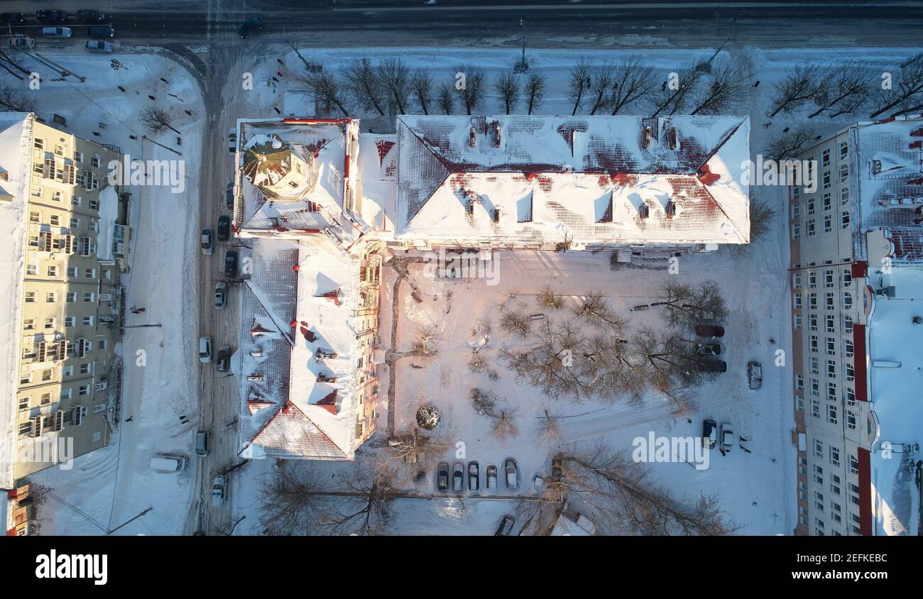 Rooftop covered with snow. Street with cars and houses Stock Photo - Alamy