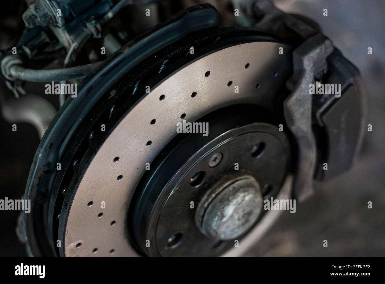 Detail of a perforated sports car disc brake, sport tuning spare parts ...