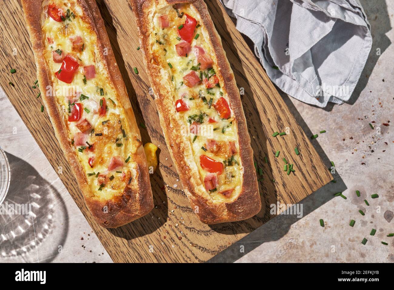 Bread boats stuffed with ham, egg, green onion and cheese for breakfast ...