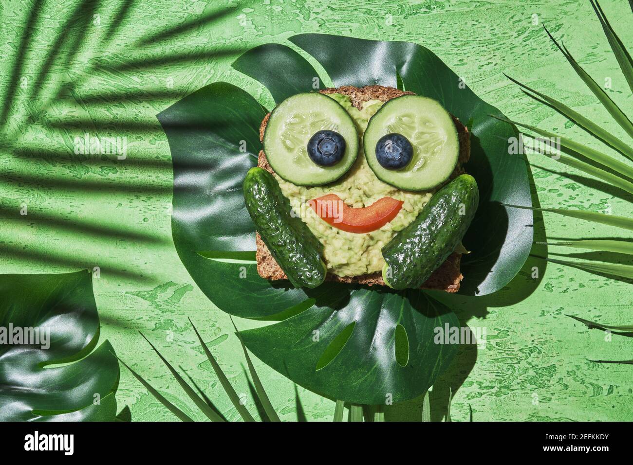 Funny Frog Toast With Cucumber And Mashed Avocado Stock Photo - Alamy
