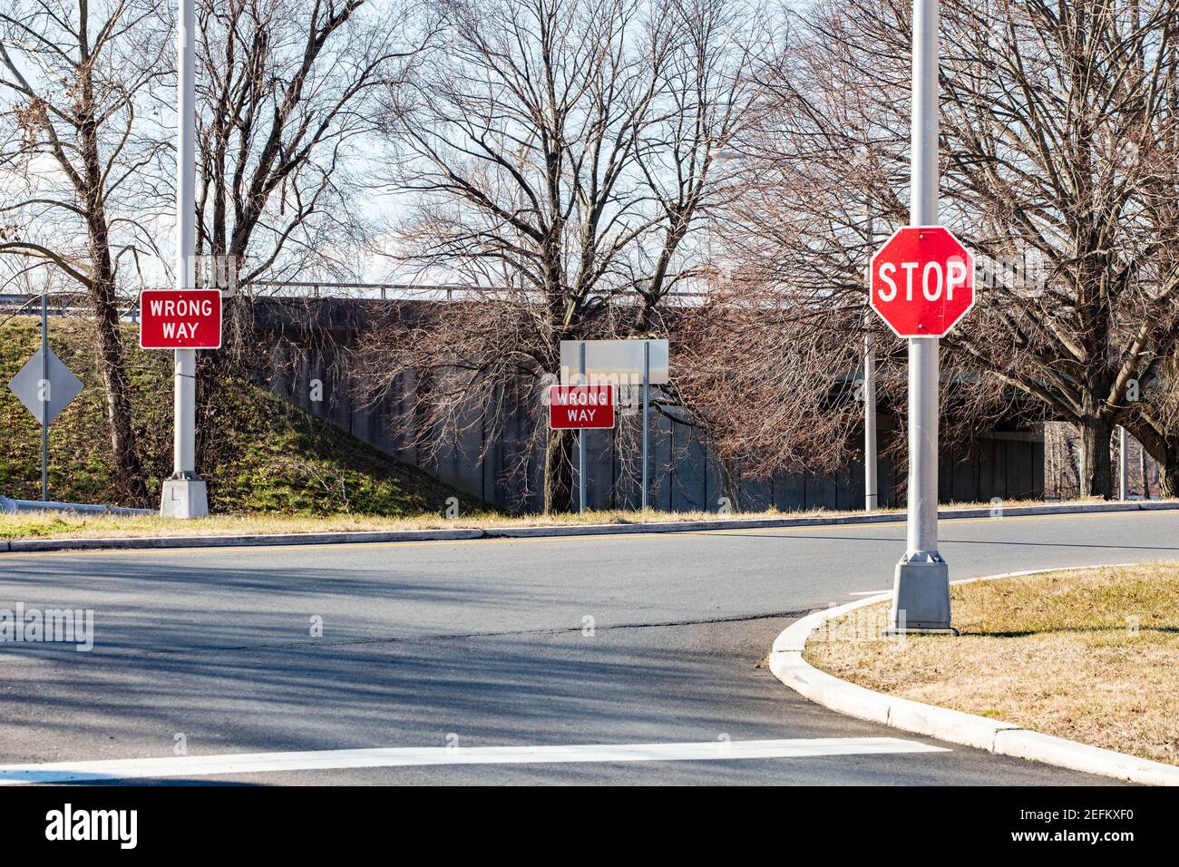 Stop wrong way street signs decision concept at day Stock Photo - Alamy