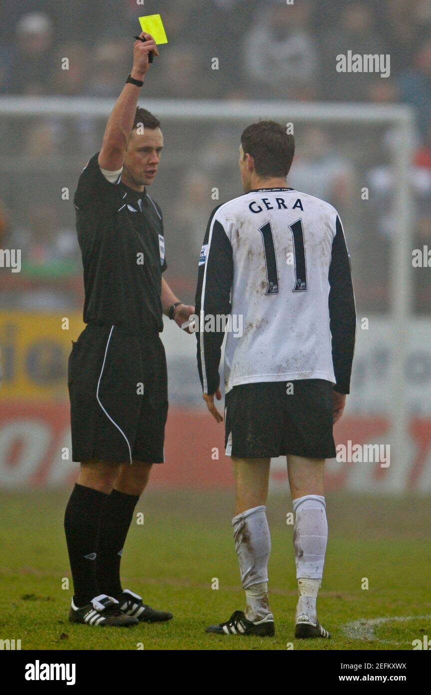 Referee stuart attwell shows a yellow card hi-res stock photography and ...