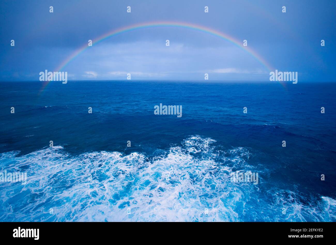 Double rainbow appears over the Pacific Ocean in the dusk at Big Island ...