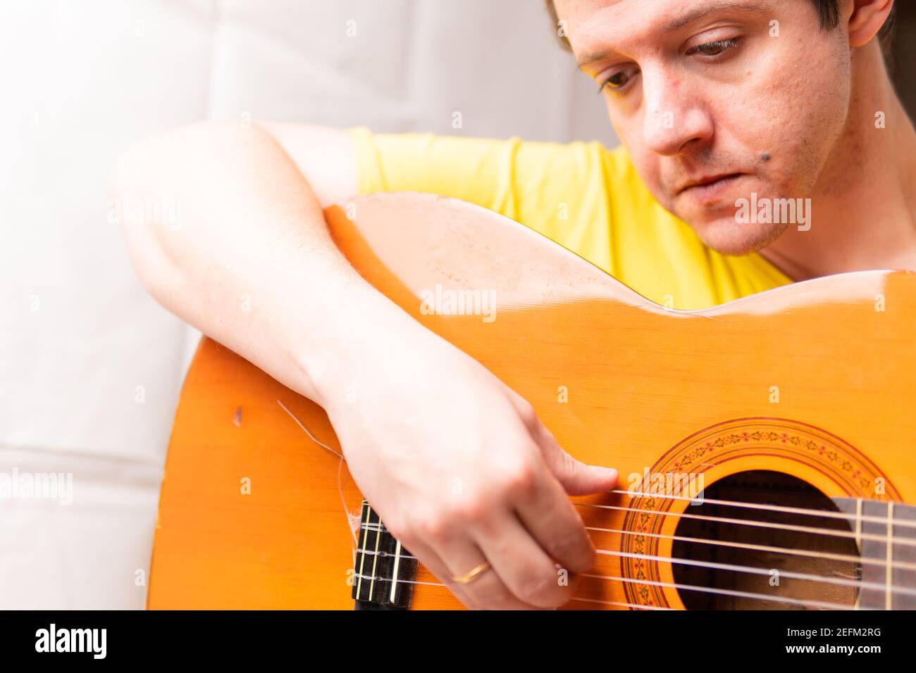 Young middle-aged man playing Spanish guitar Stock Photo - Alamy