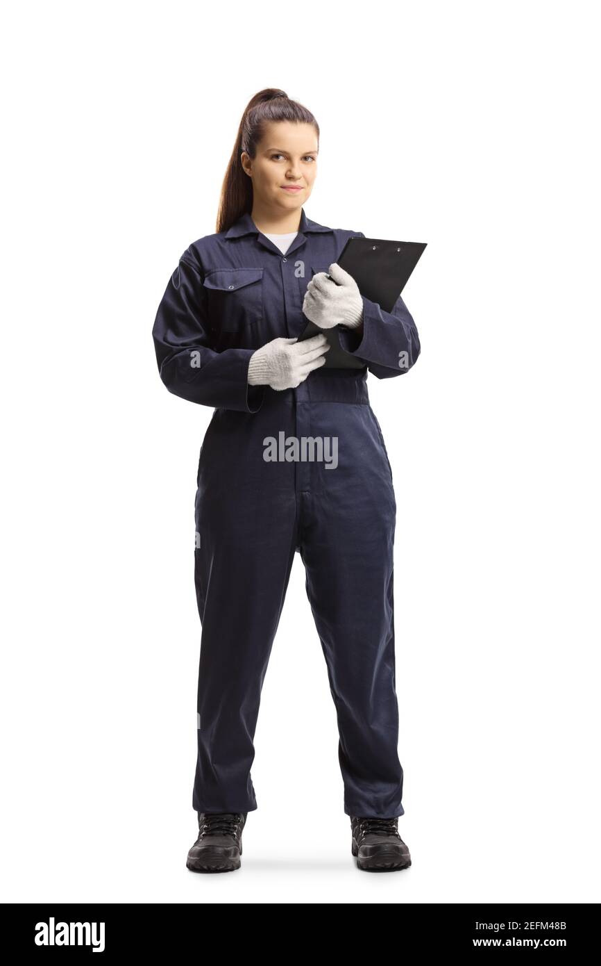 Full length portrait of a female mechanic in a uniform holding a ...