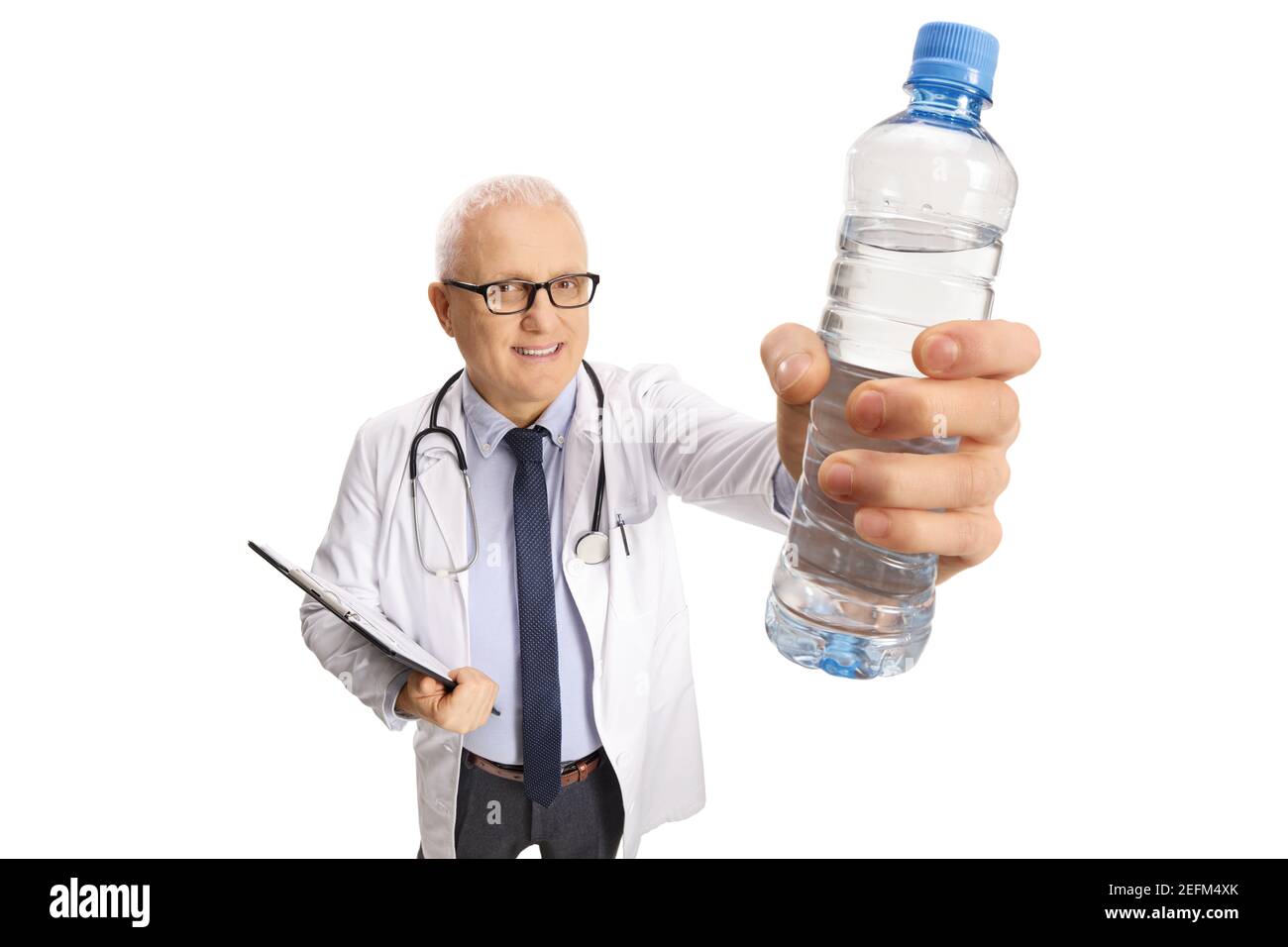 Mature doctor holding a bottle of water isolated on white background ...