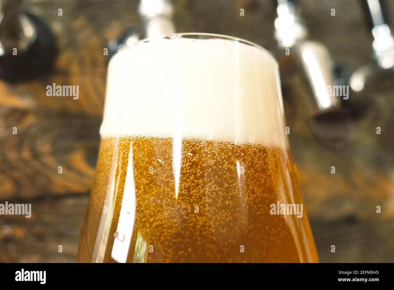 Pouring Beer Into A Glass From The Tap At The Bar Beer Bottling Stock