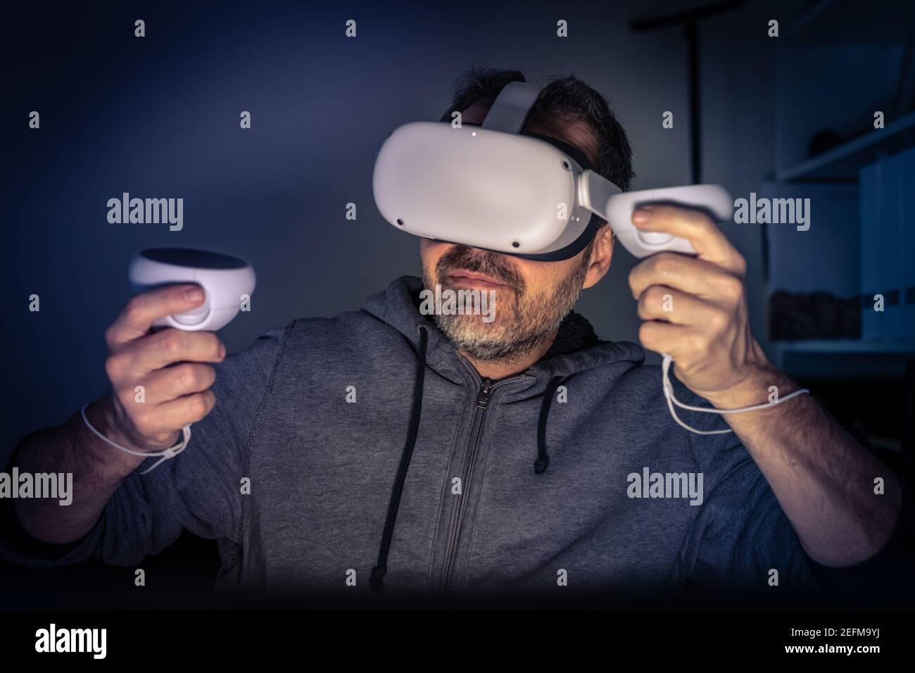Man playing with virtual reality device. Cyberpunk futuristic mood ...