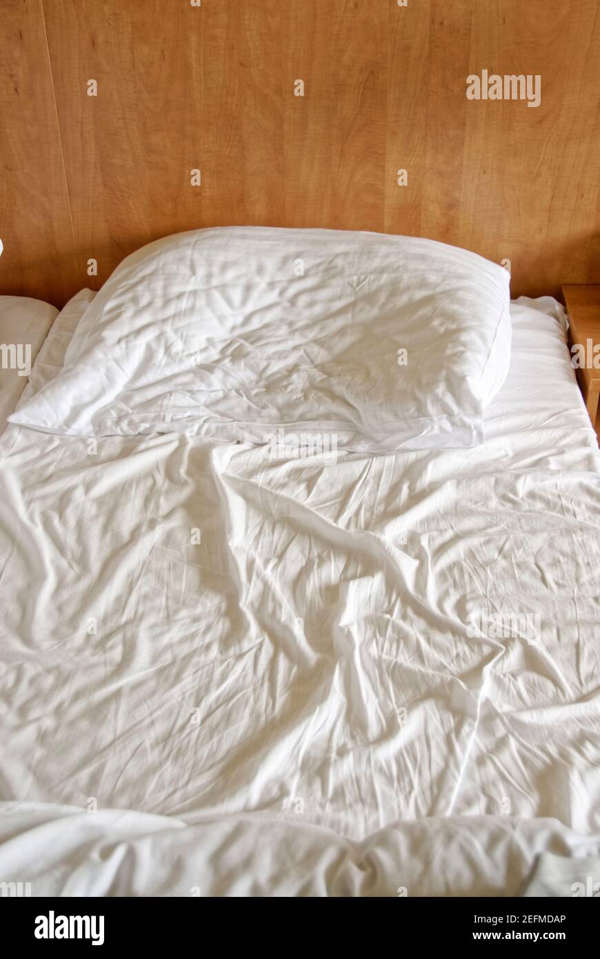 used bed in a hotel room Stock Photo - Alamy