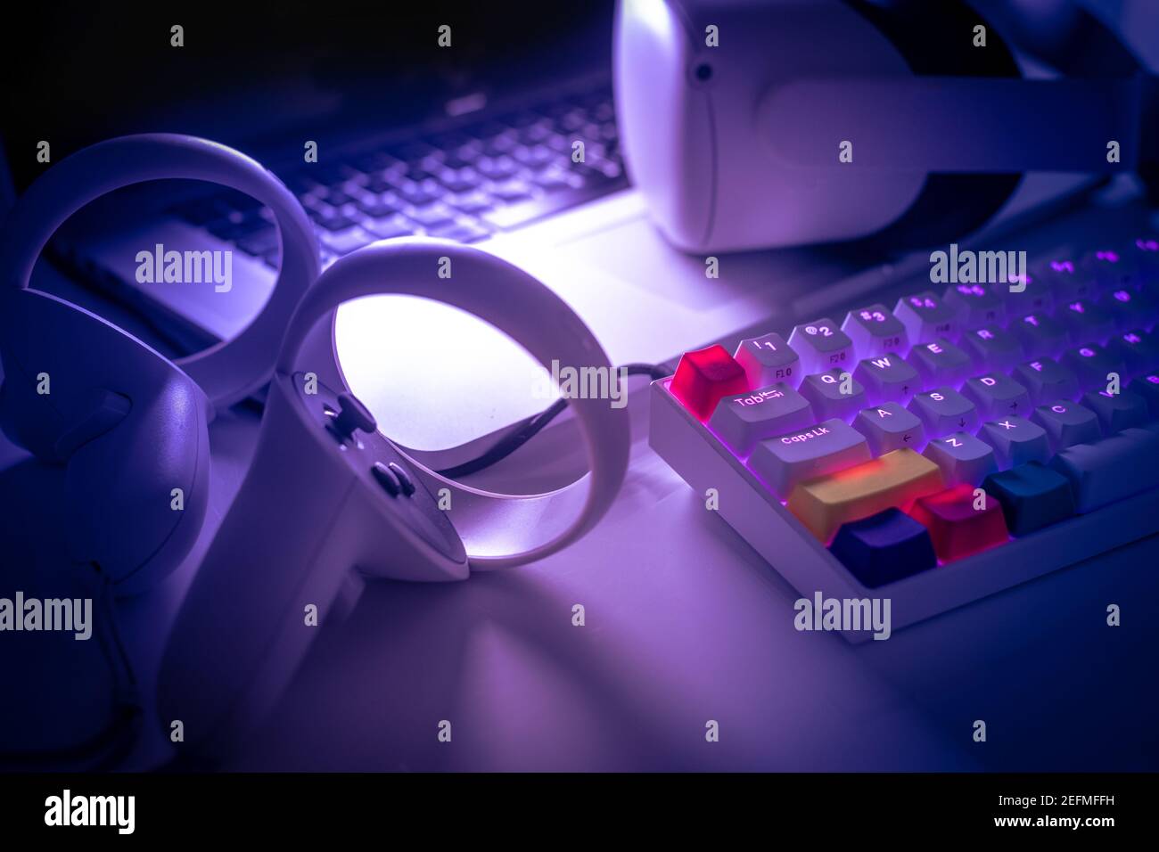 Virtual reality devices on the desk. Laptop VR 3D viewer air joystick ...