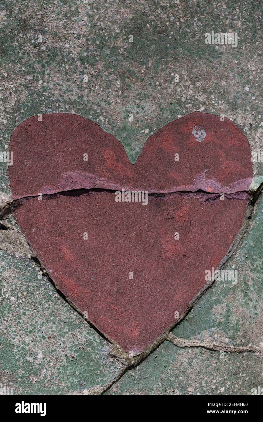 A cracked cement heart Stock Photo - Alamy