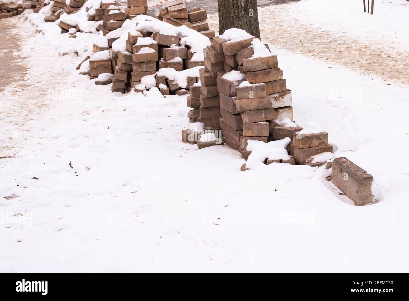 Sand and blocks at a construction site in the snow Stock Photo - Alamy