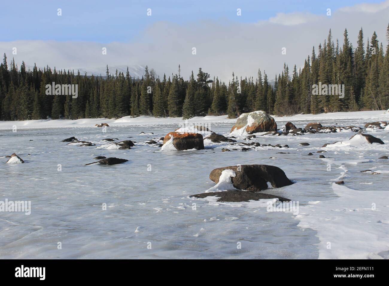 Frozen mountain lake in winter Stock Photo - Alamy