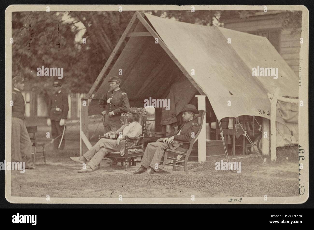 Officers relaxing outside a tent Stock Photo - Alamy