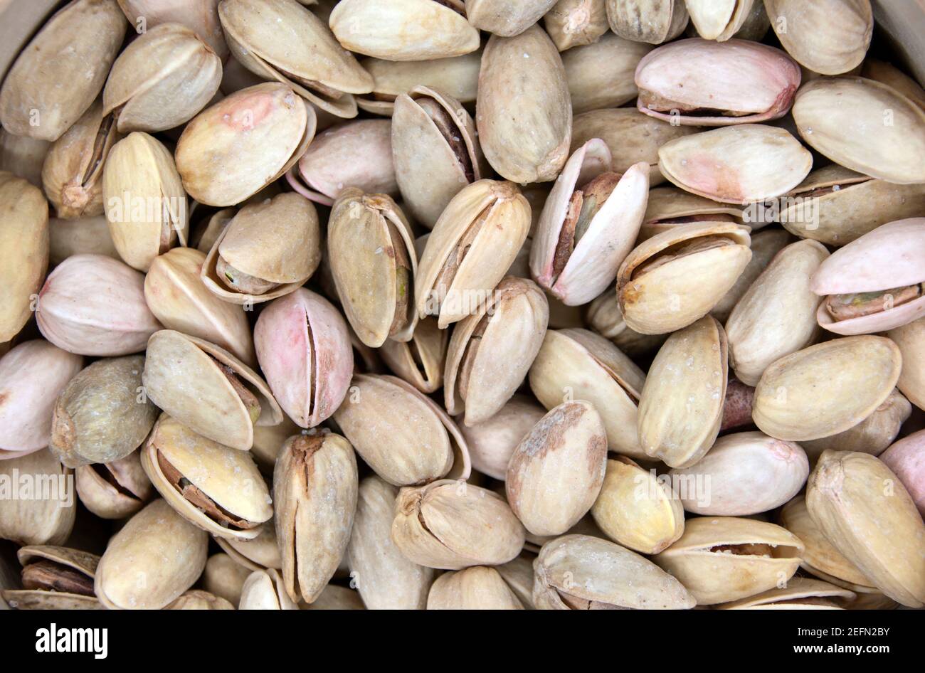 Salted pistachios in a box close up Stock Photo - Alamy