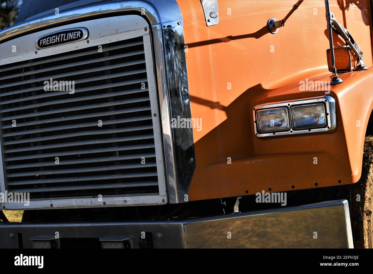 Orange freightliner semi Stock Photo - Alamy