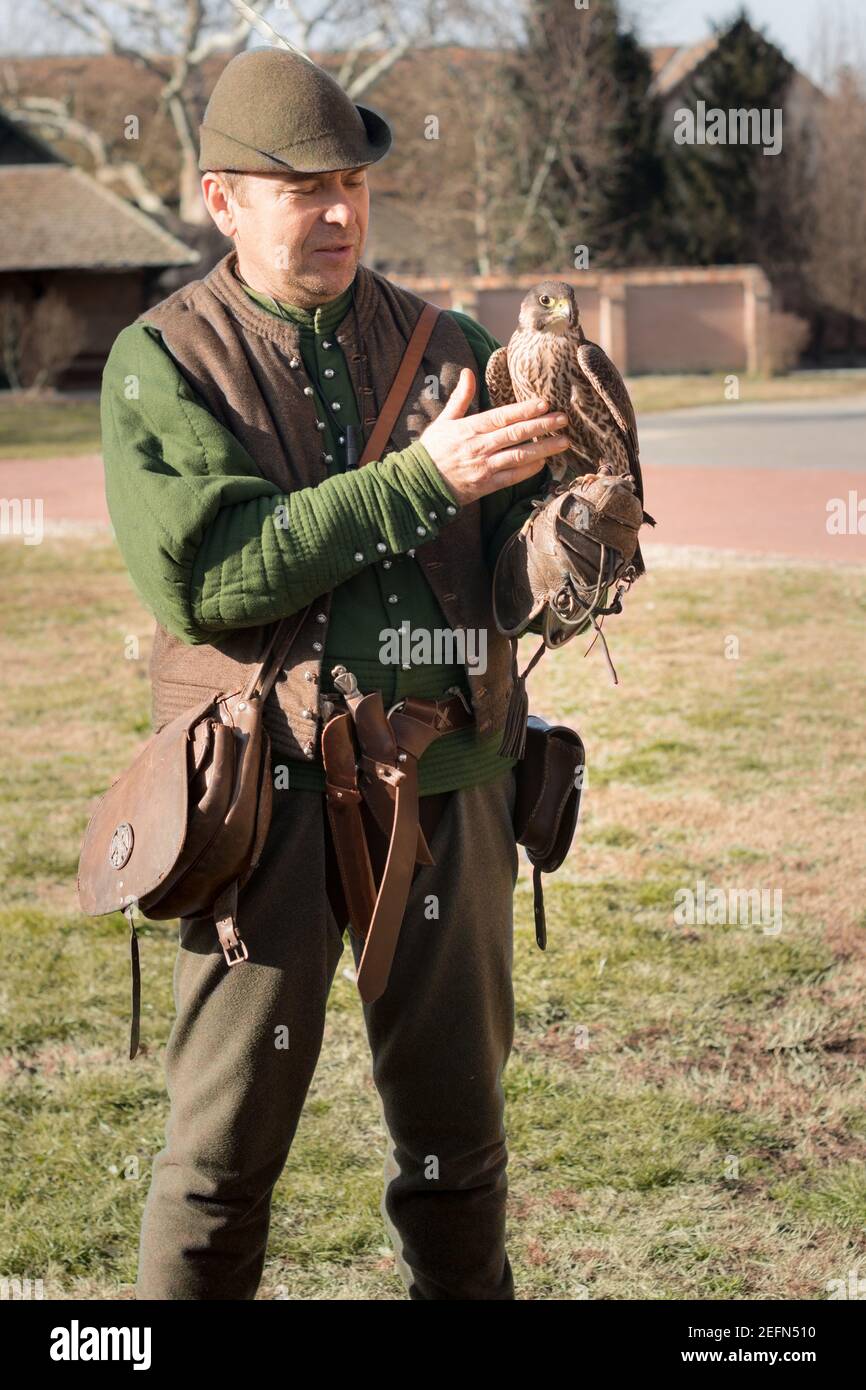 Hunting man with a bird of prey Stock Photo - Alamy