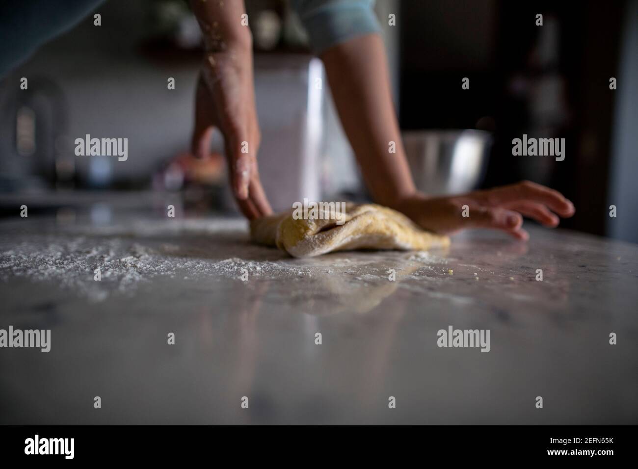 Flour and dough being kneaded on kitchen countertop Stock Photo - Alamy