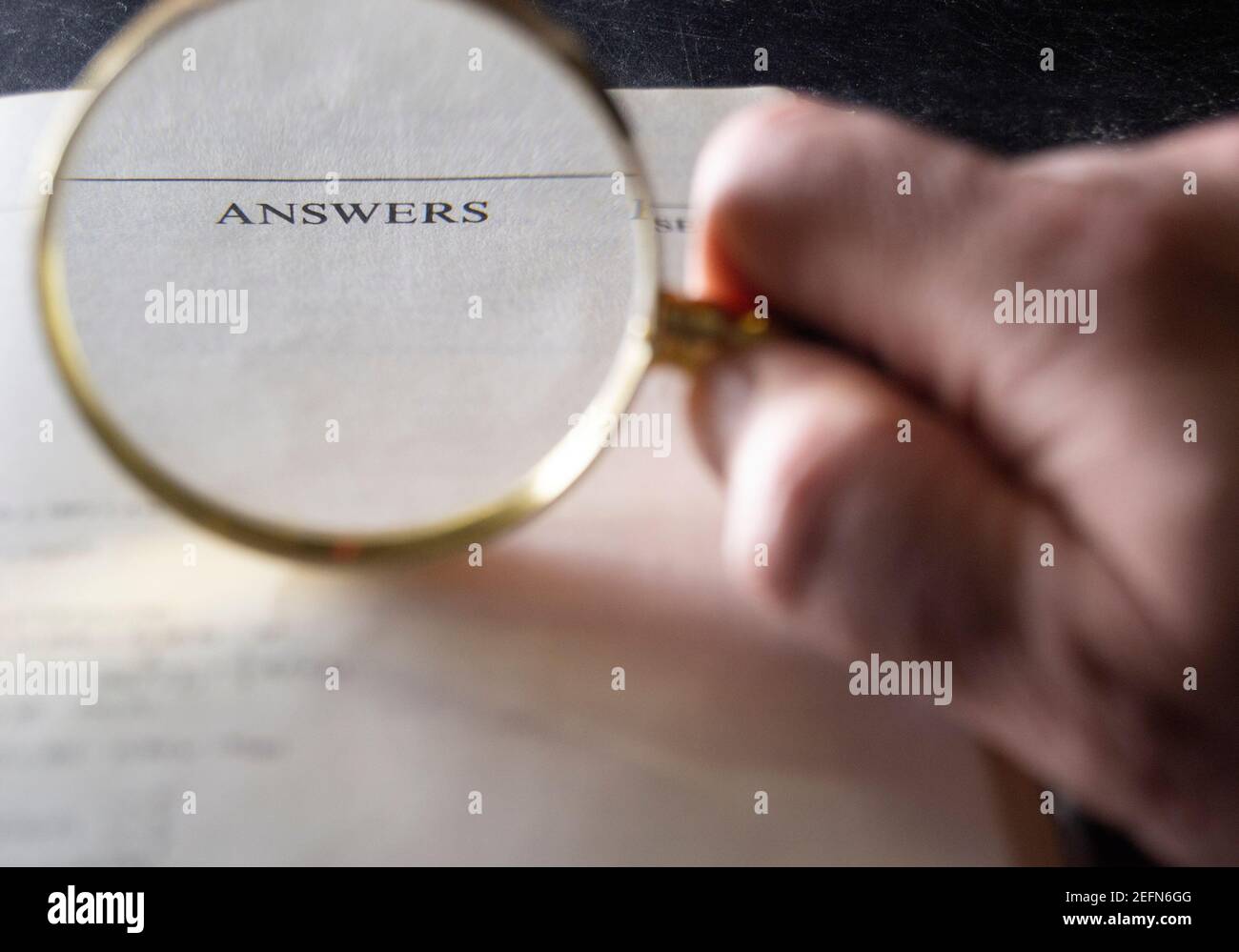 magnifying glass analysing the word "answers". Concept for internet ...