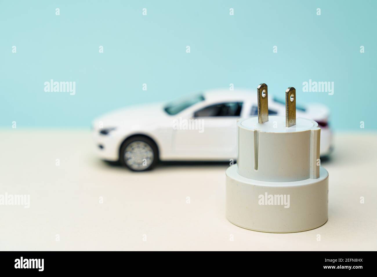Toy car and electrical plug. Electric car and green car concept Stock ...