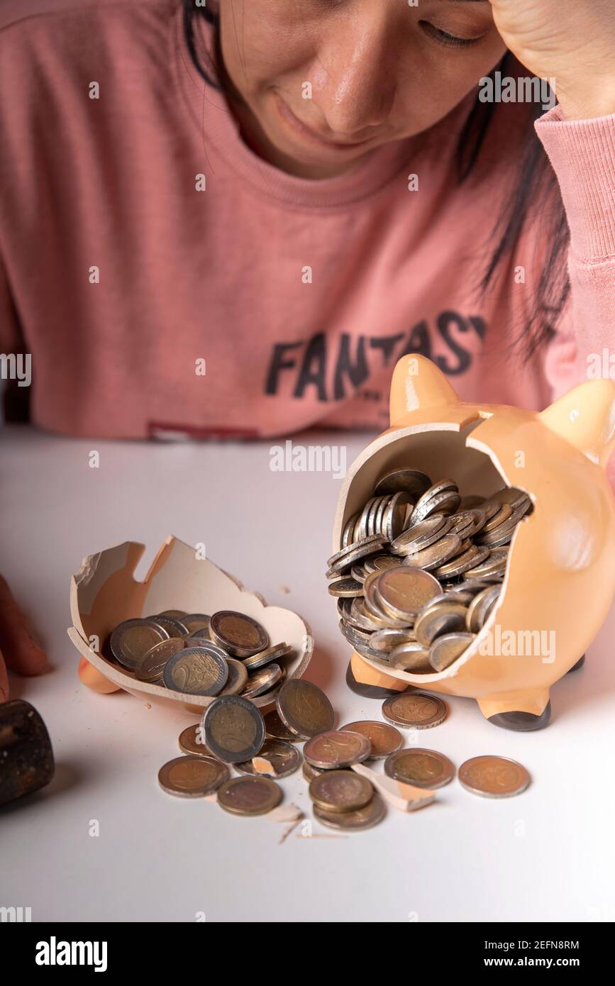 money taken out by breaking the piggy bank Stock Photo - Alamy