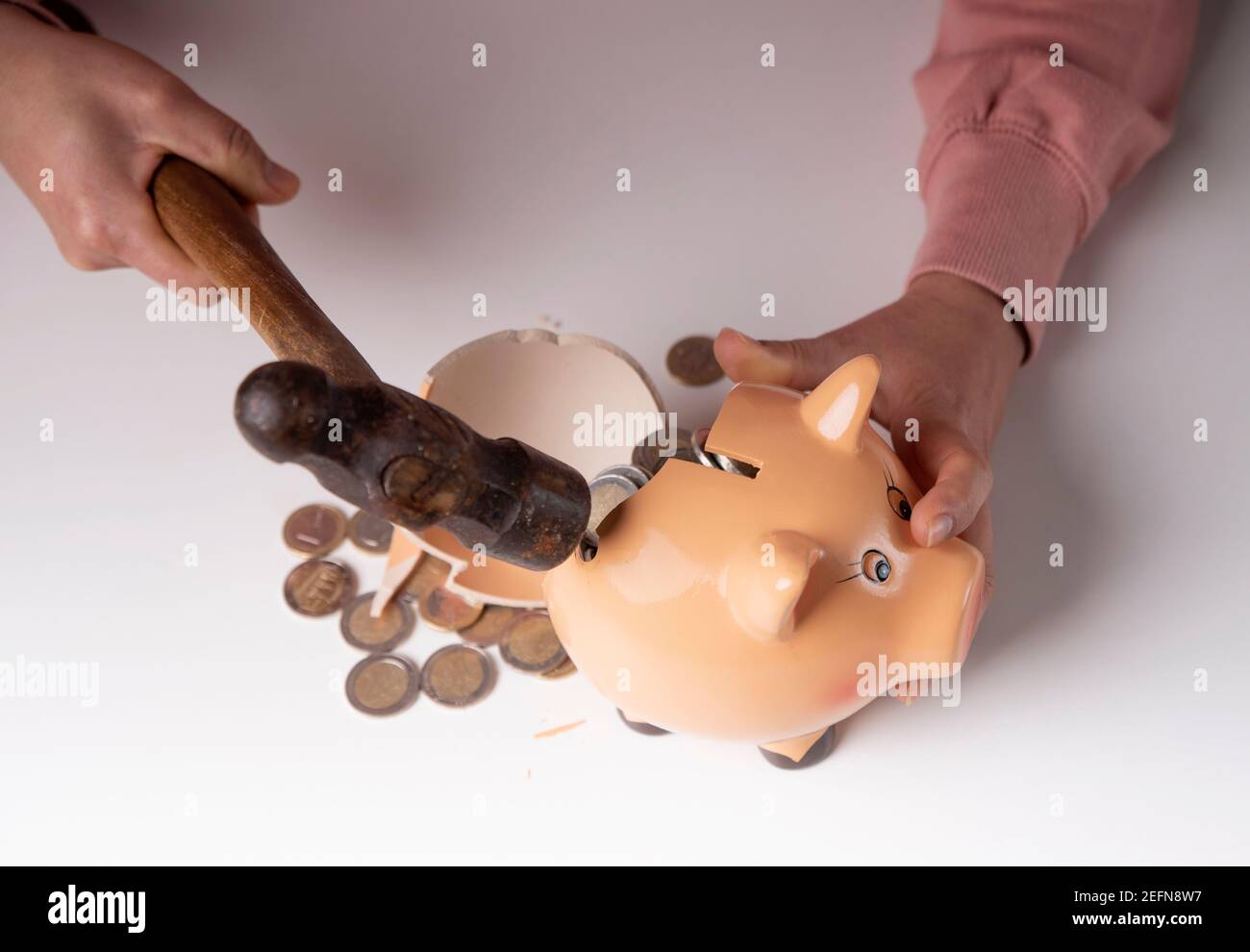 money taken out by breaking the piggy bank Stock Photo - Alamy