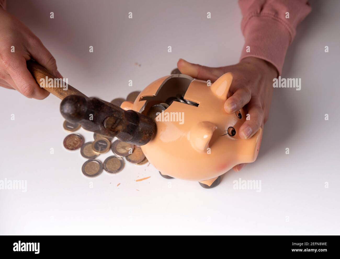 money taken out by breaking the piggy bank Stock Photo - Alamy