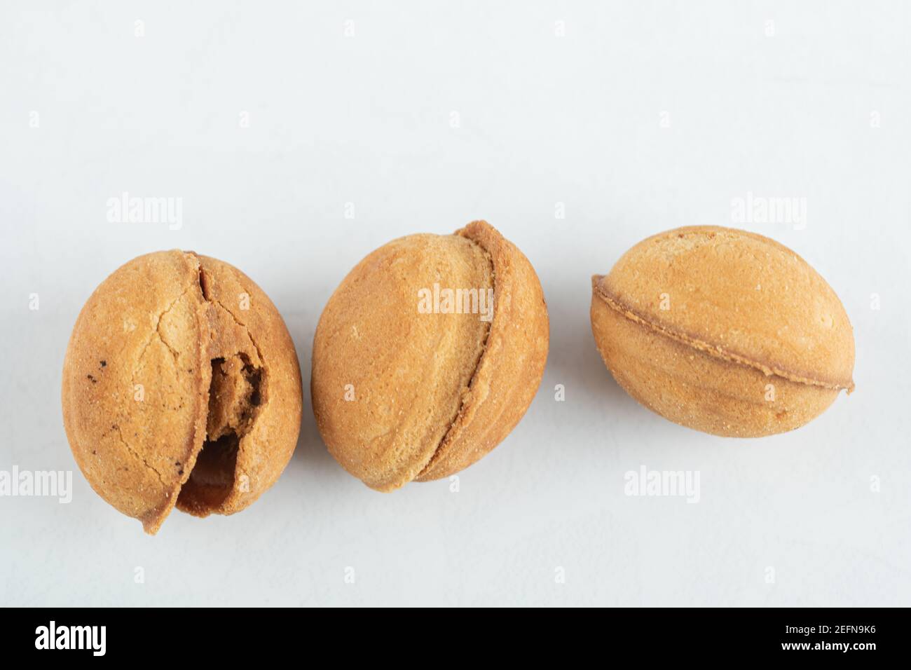 Walnut sweet cookies on a white background Stock Photo - Alamy