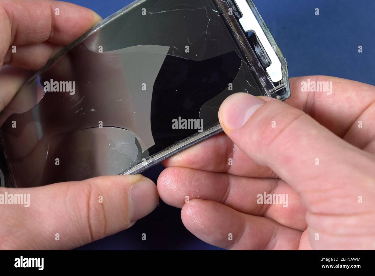 a Screen broken smartphone. Split screen sensor Stock Photo - Alamy