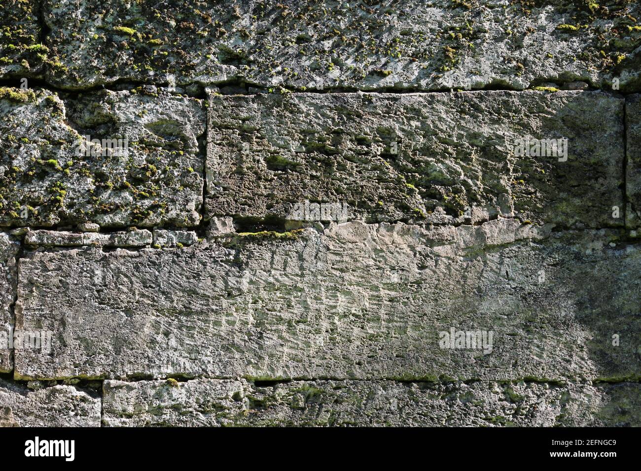 background from ancient stone. ancient wall that separates two parts of ...