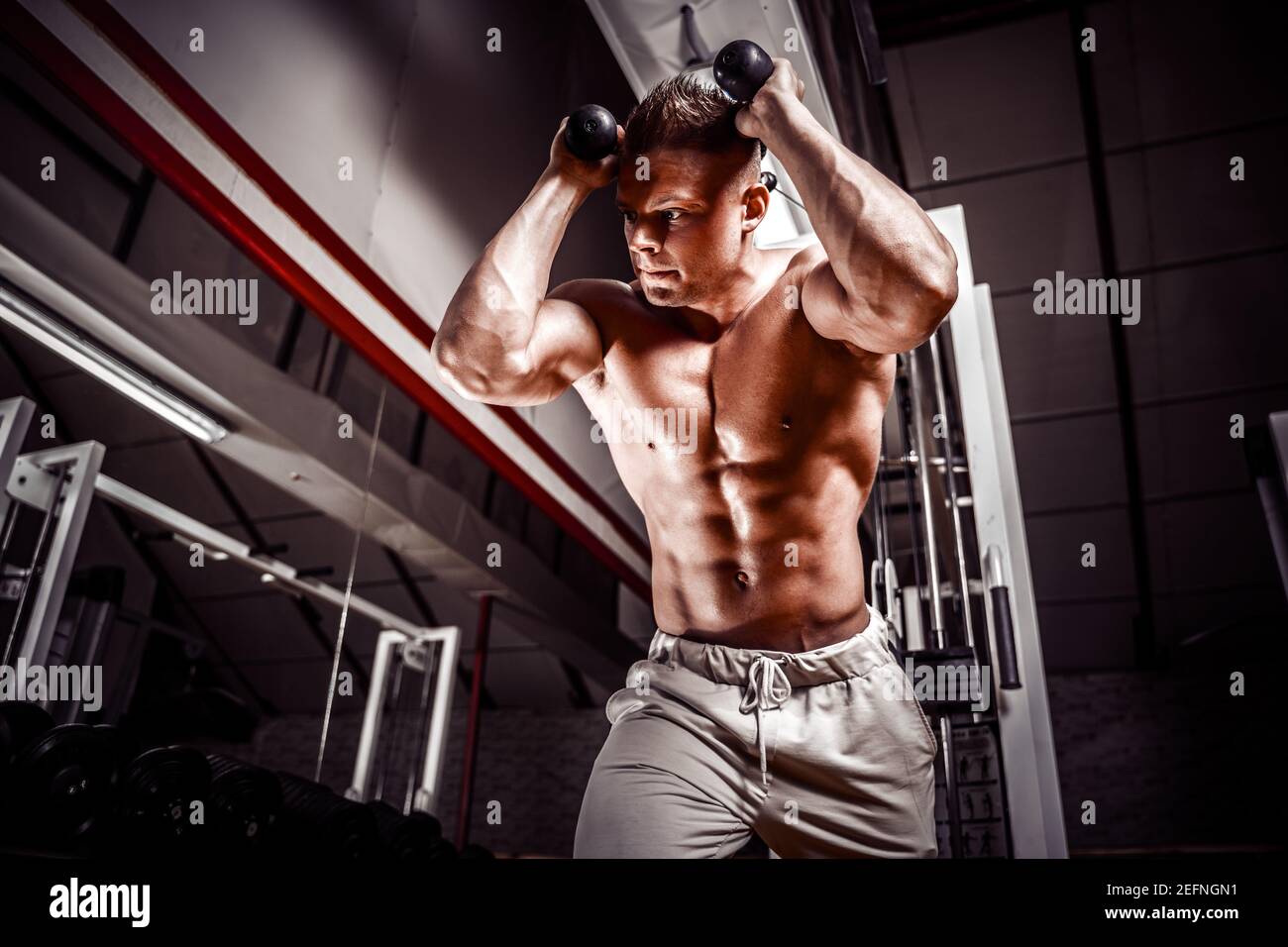 Handsome man exercising doing abdominal exercise in gym Stock Photo - Alamy