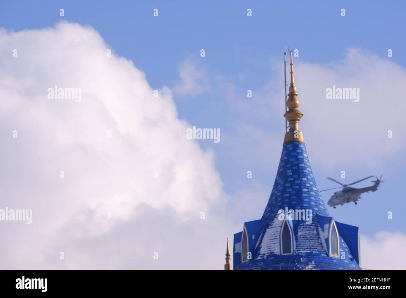 Helicopter Flying Over Blue Vintage Castle Tower Stock Photo - Alamy