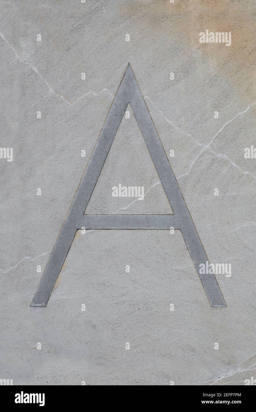 Metal letter A, embedded in sandstone Stock Photo - Alamy