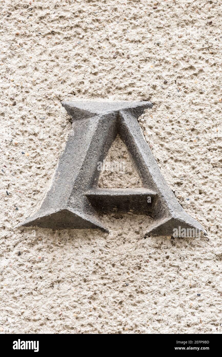 Large letter A on roughly plastered wall Stock Photo - Alamy
