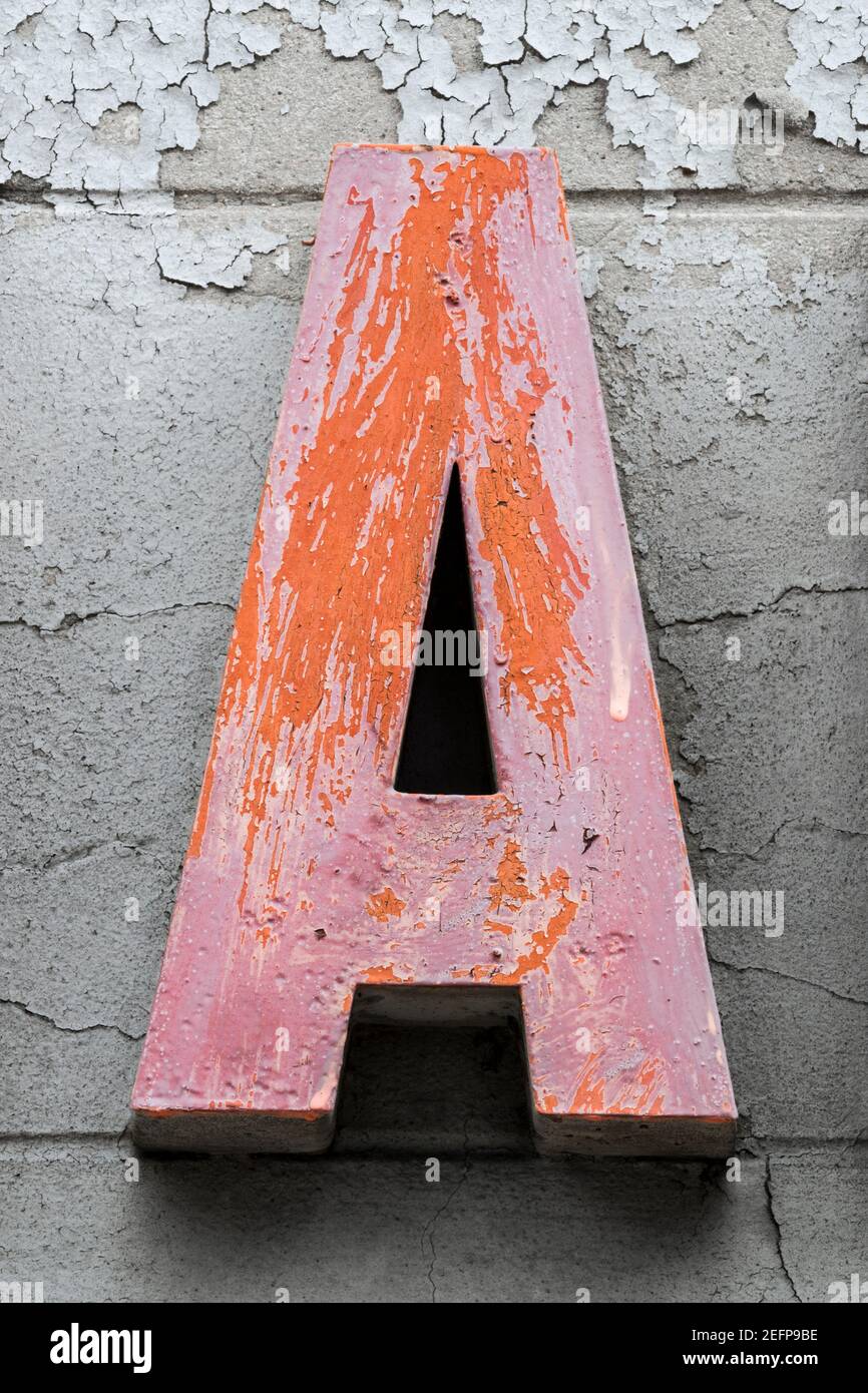 Weathered purple metal Letter A Stock Photo - Alamy