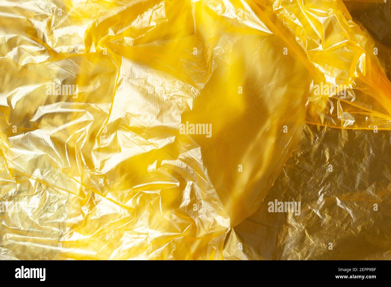 Background, texture from yellow recyclable polyethylene. Eco, zero ...