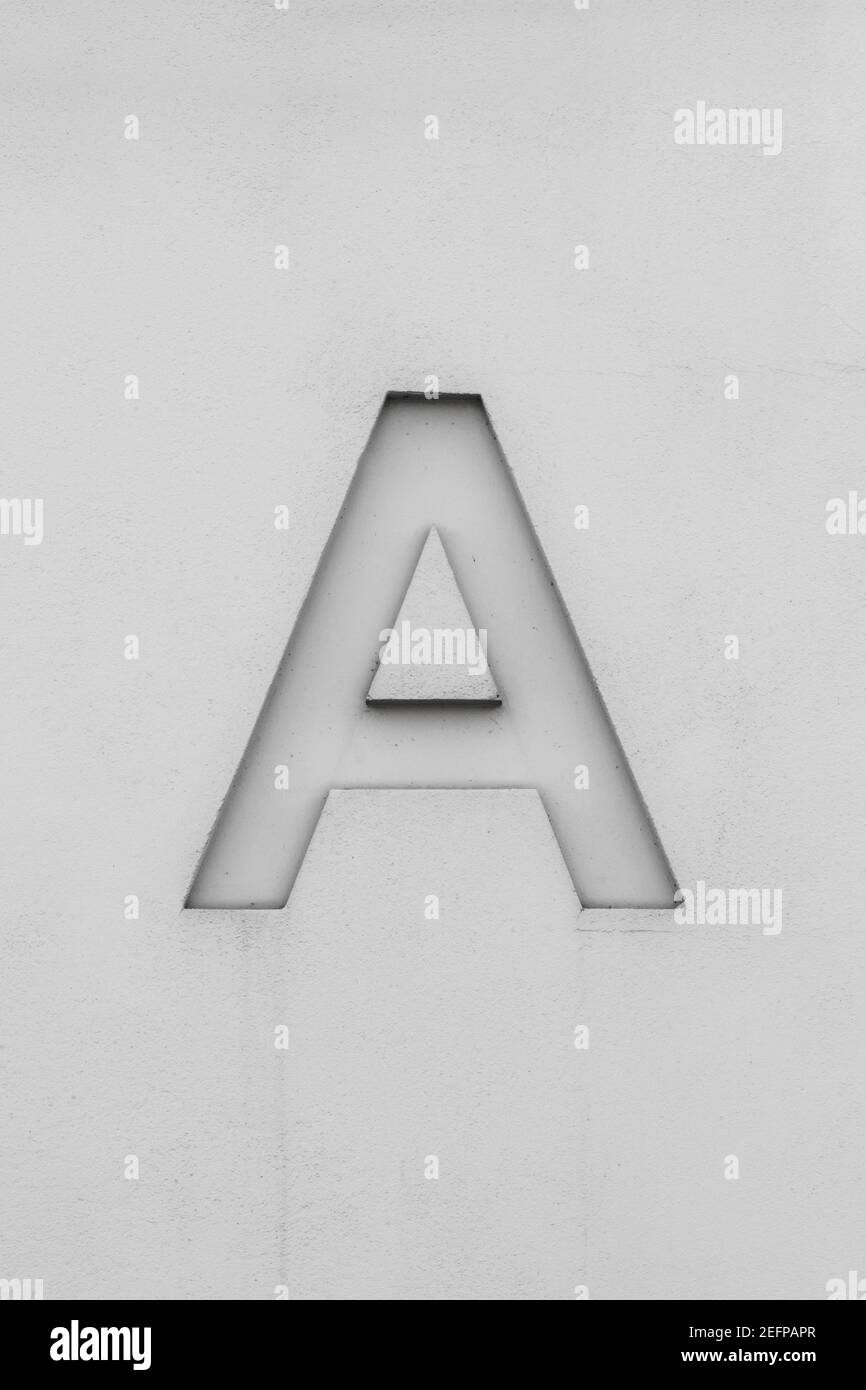 Capital letter A negative relief in concrete Stock Photo - Alamy