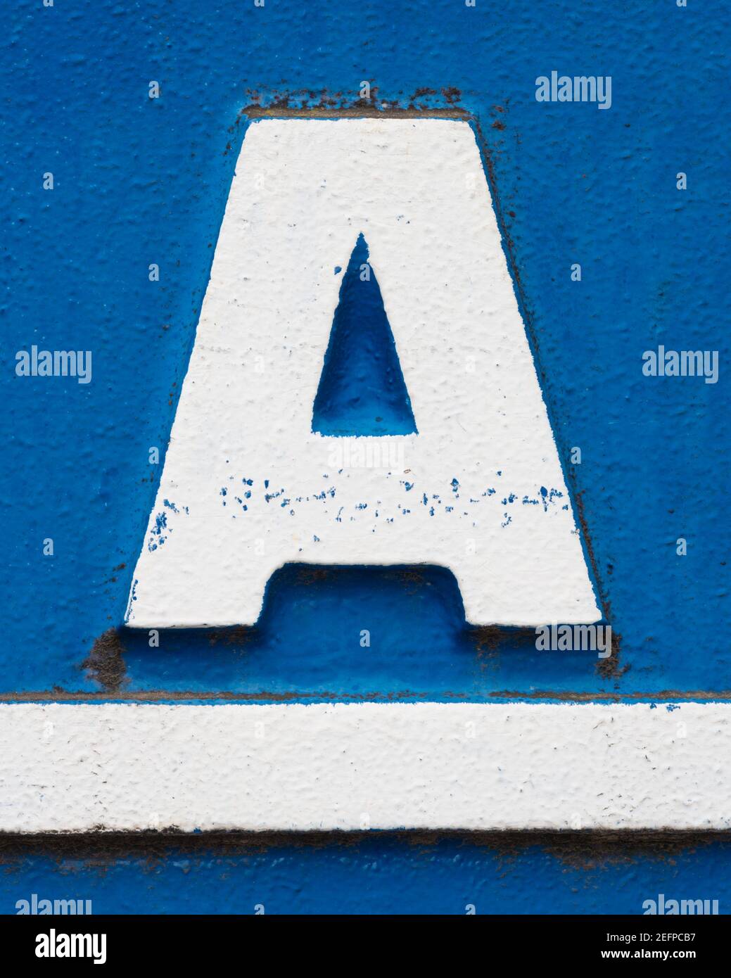 White metal letter A with white underline on blue background Stock ...