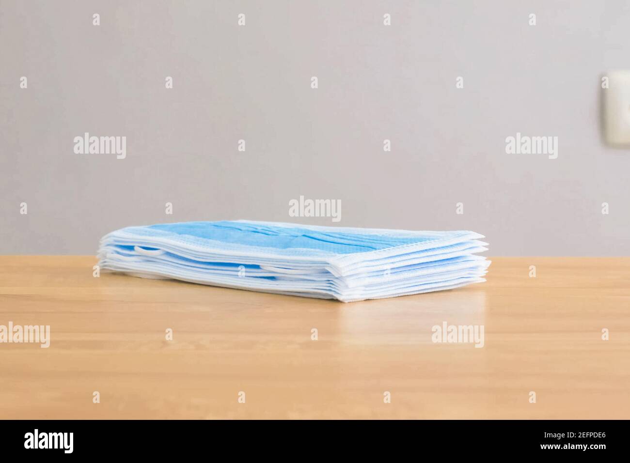 A pack of medical masks on the table. Personal protective equipment ...