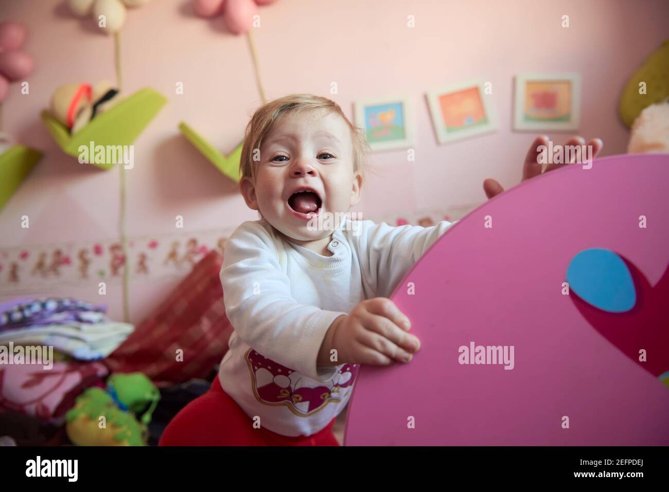 cute little one year old baby and making first steps Stock Photo - Alamy