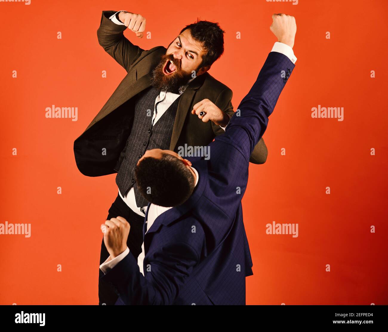 Men with beards fight on red background. Business confrontation concept ...