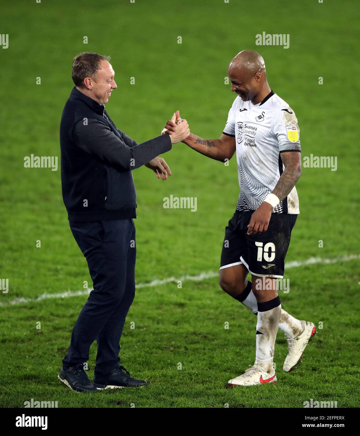 Swansea City manager Steve Cooper and Andre Ayew celebrate after the ...