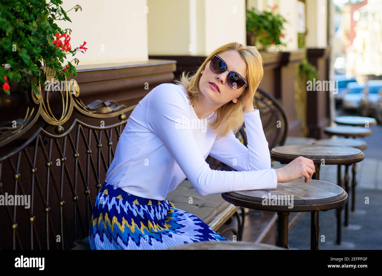 Wait for waitress. Woman sits alone bored cafe terrace urban background ...