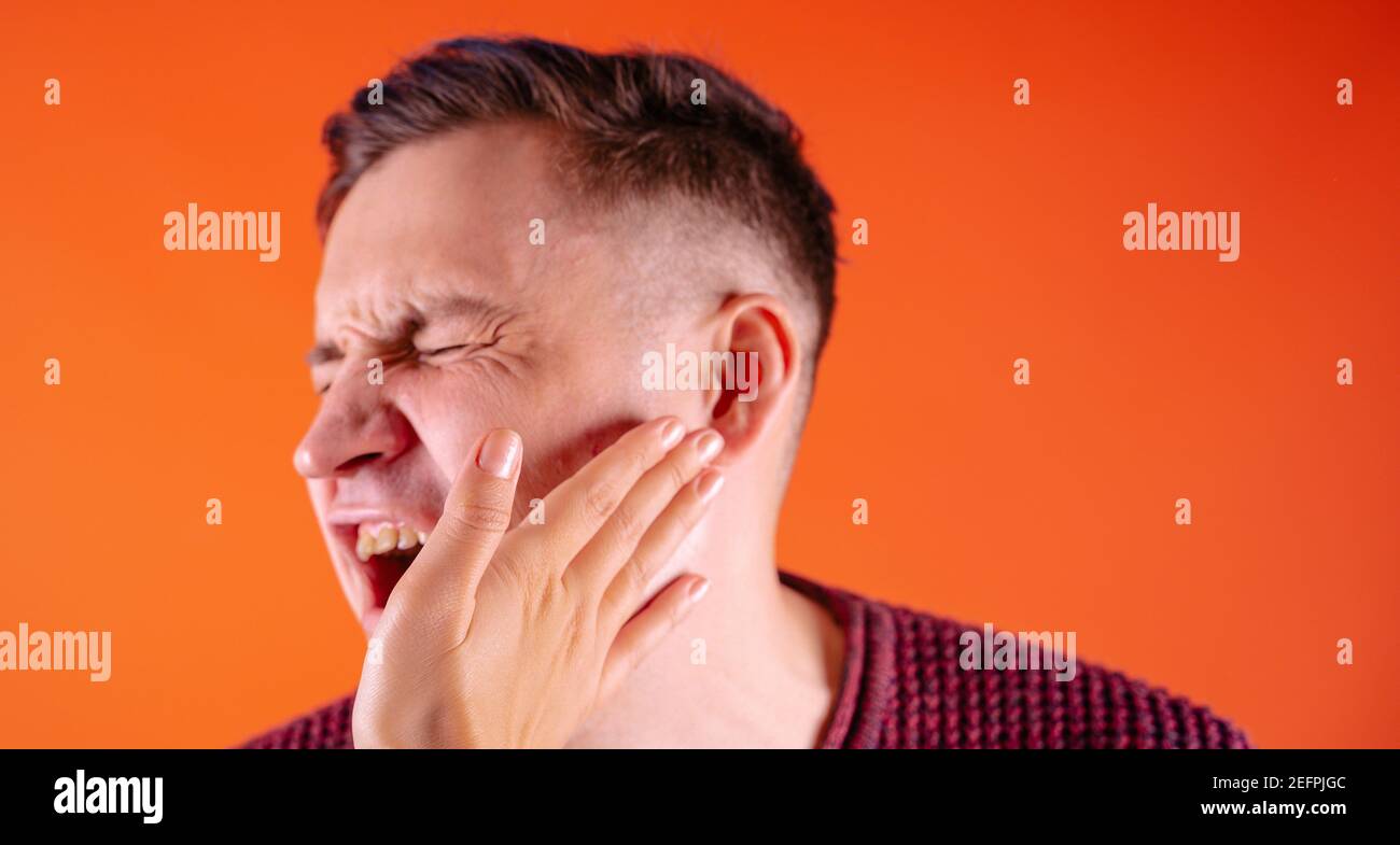 Crop person slapping scared man in face. Emotional male getting slapped ...