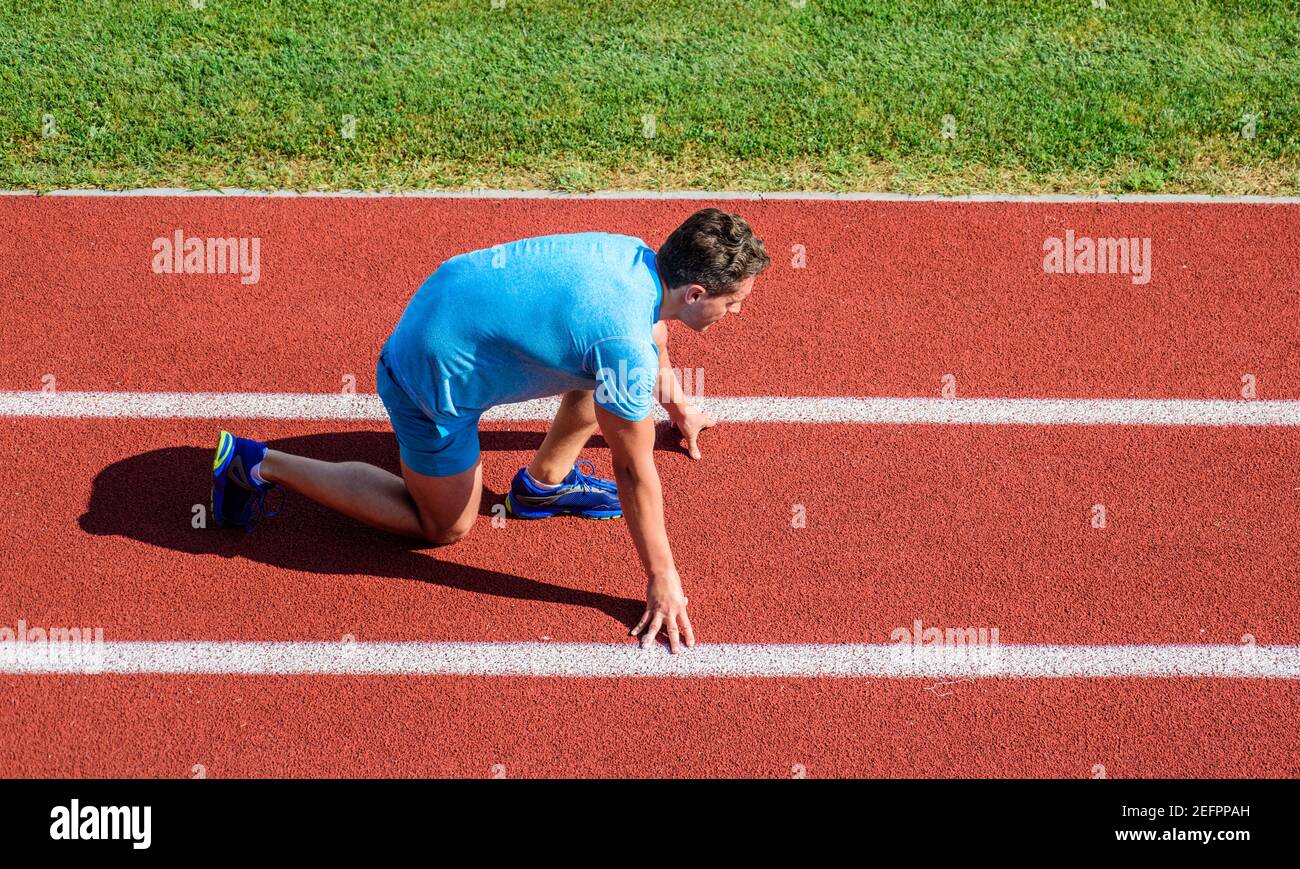 Runner ready to go. Athlete runner prepare to race at stadium. How to ...