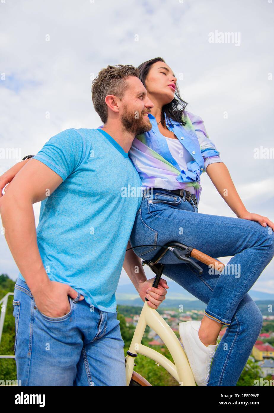 Girl likes he rides her on handlebar. Girl sit on handlebar of his bike ...