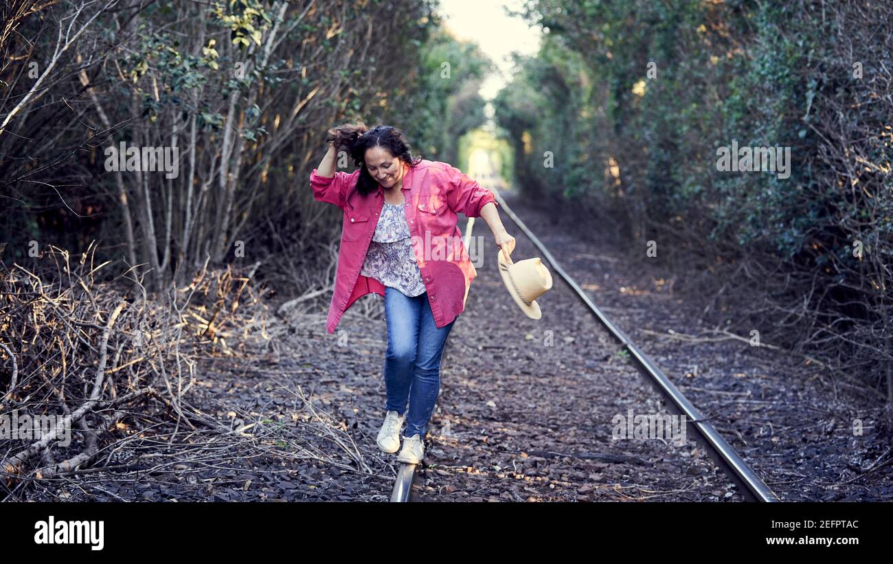 Beautiful girl on train tracks hi-res stock photography and images - Alamy