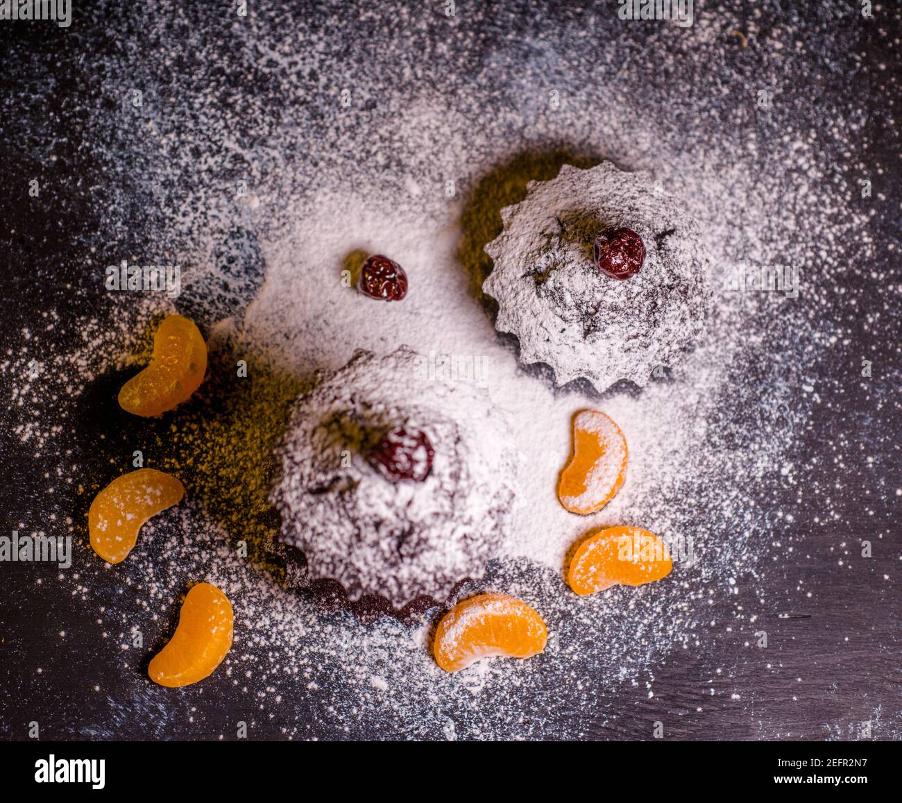 chocolate muffins sprinkled with goodies with cherries and chocolate ...