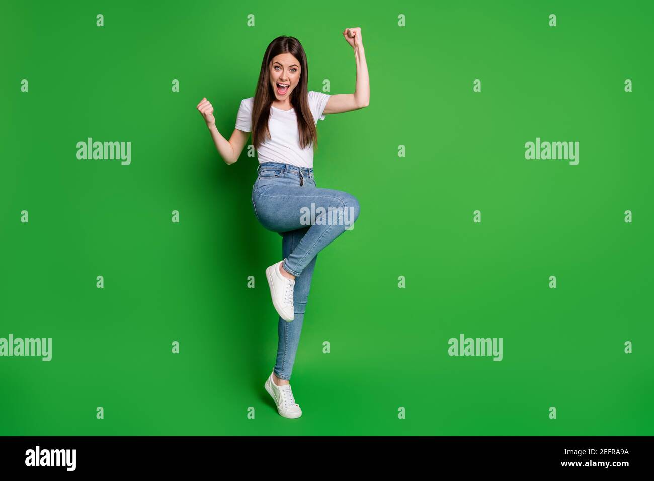 Full length photo of cheerful winner girl dressed casual outfit arms up ...