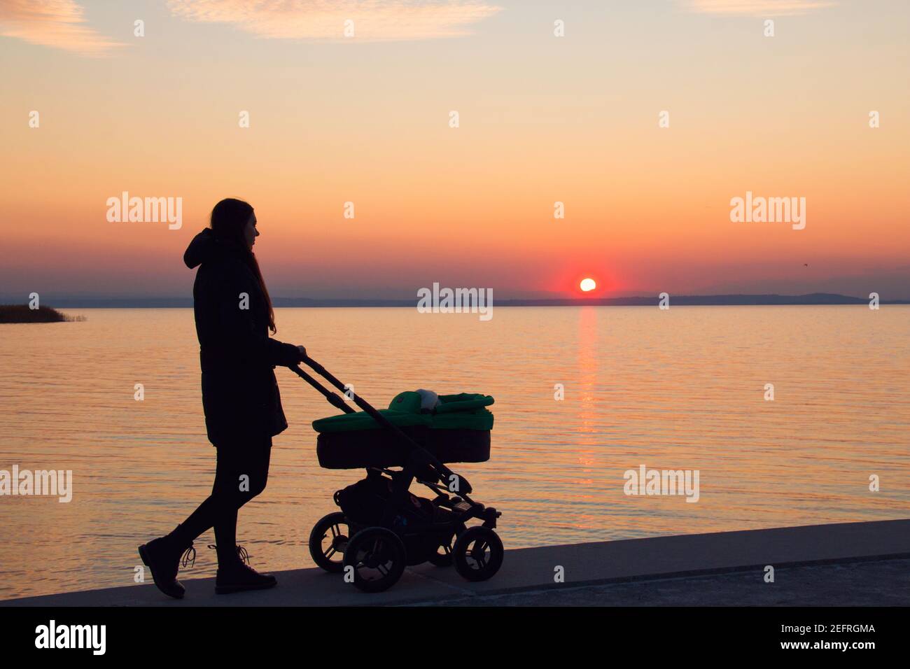 Shadow pushing stroller hi-res stock photography and images - Alamy